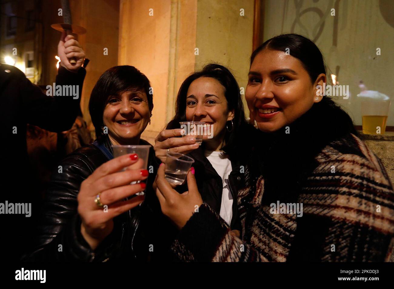 Several people have a drink in a bar during the procession and burial ...