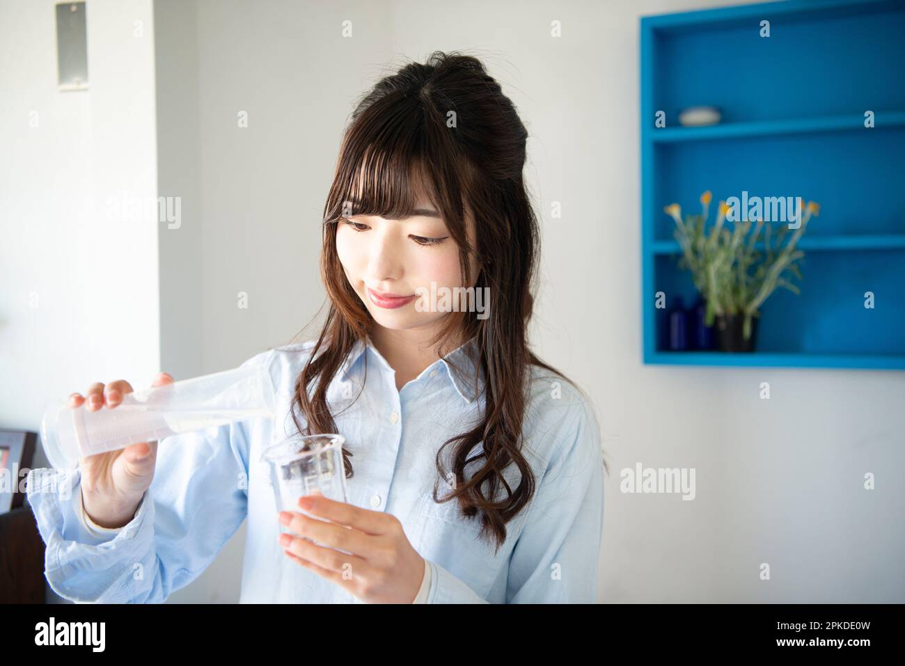 Woman mixing aroma oil Stock Photo - Alamy