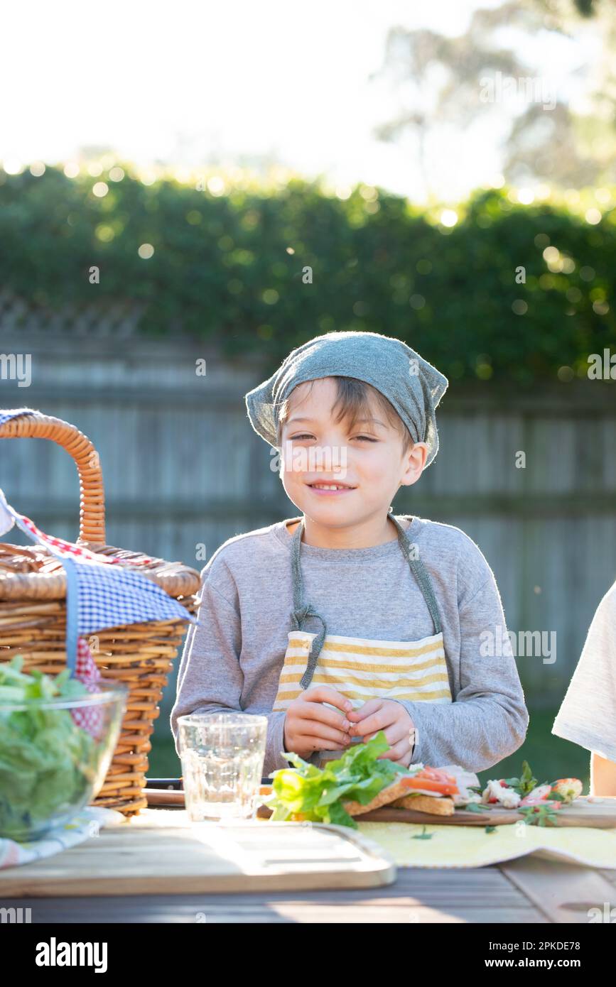 Boy making sandwich in garden Stock Photo - Alamy