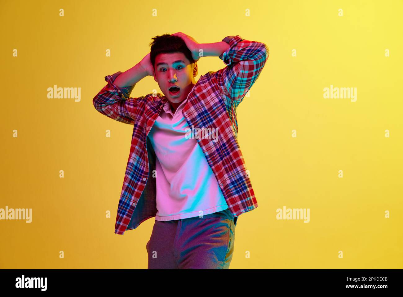 Astonished look. Shocked and surprised. Young guy in casual stylish ...