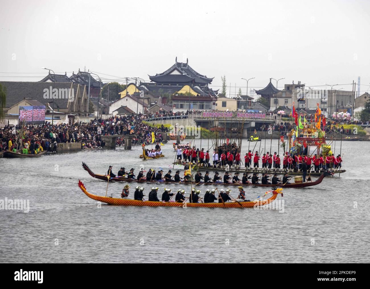 People participate in a boat race during the Qingming Festival in ...
