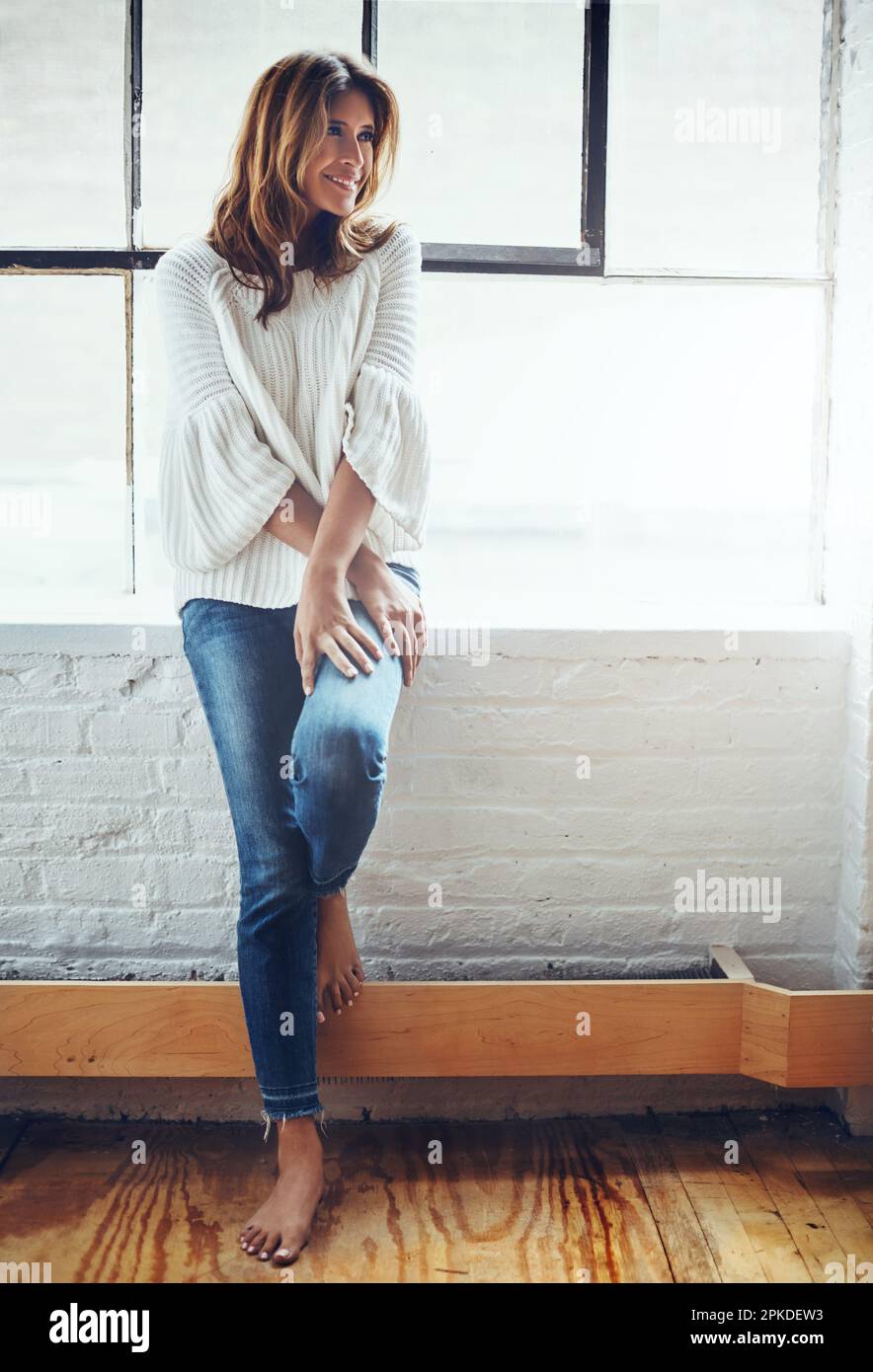 Shes as beautiful as she is confident. an attractive young woman ...