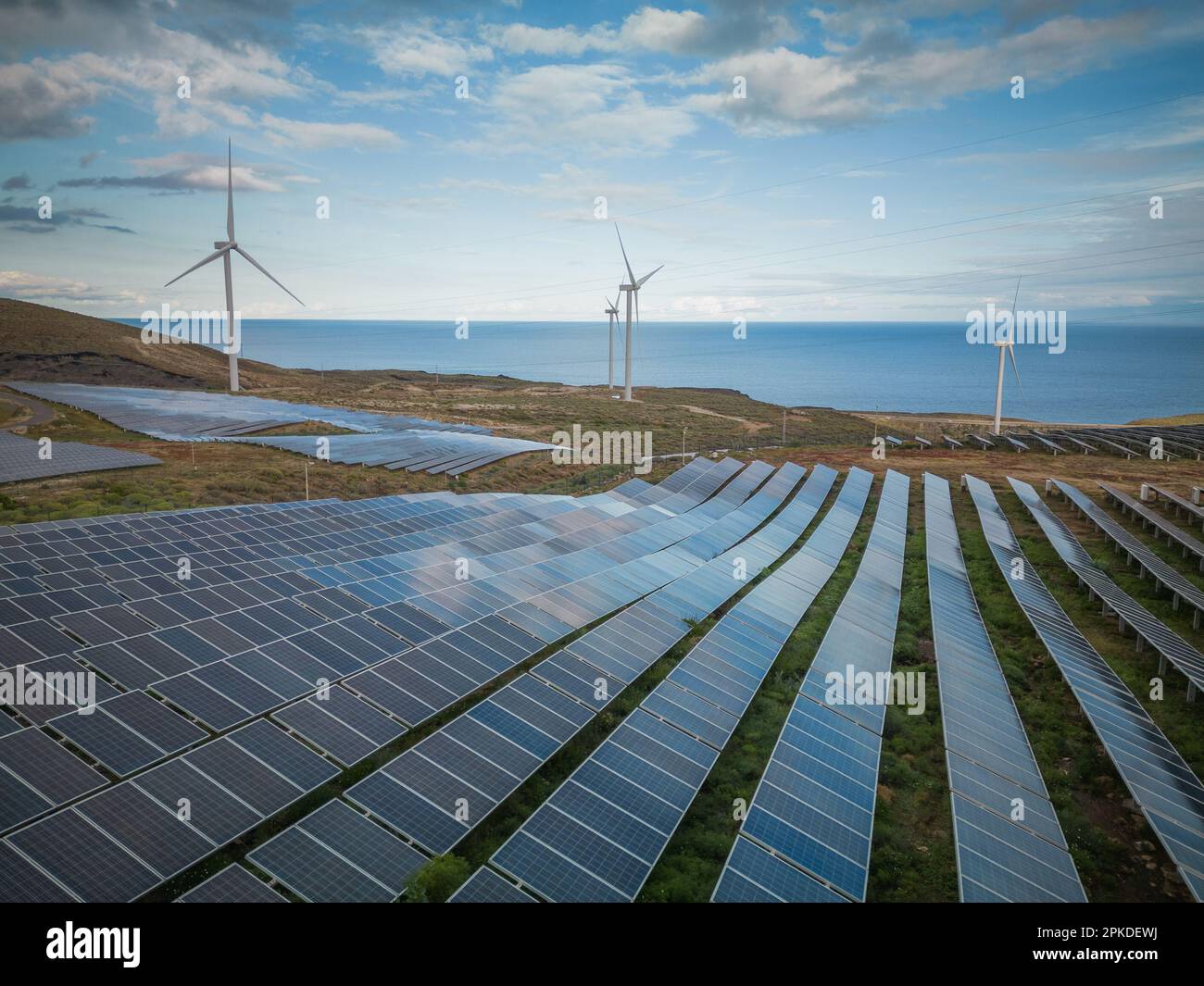 Solar power plant with photovoltaic panels and wind turbines to produce ...
