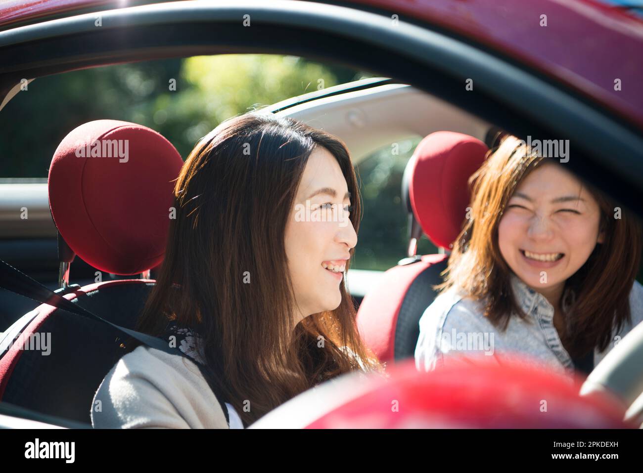 Two women enjoying a drive Stock Photo - Alamy