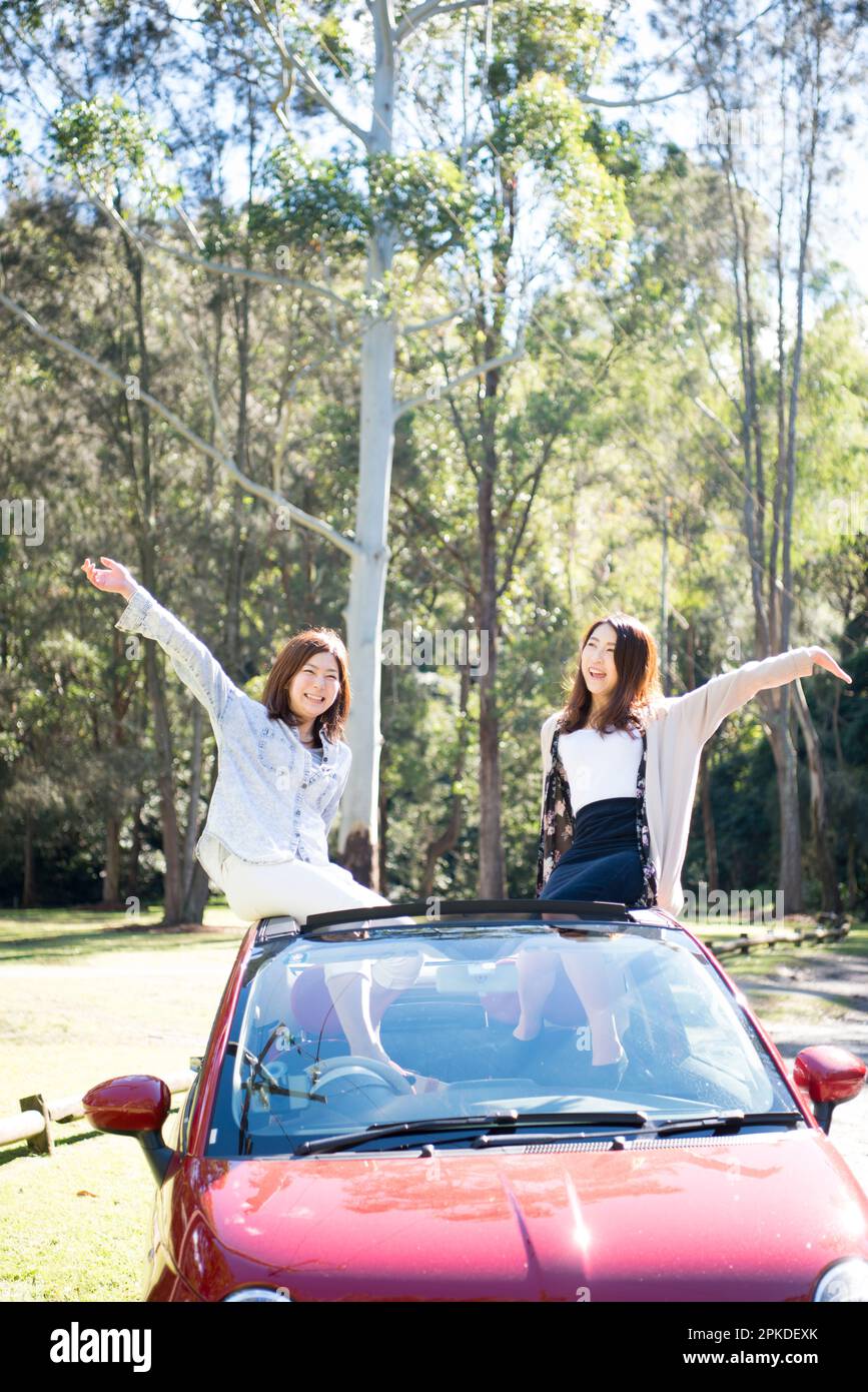 Two japanese women sitting hi-res stock photography and images - Alamy