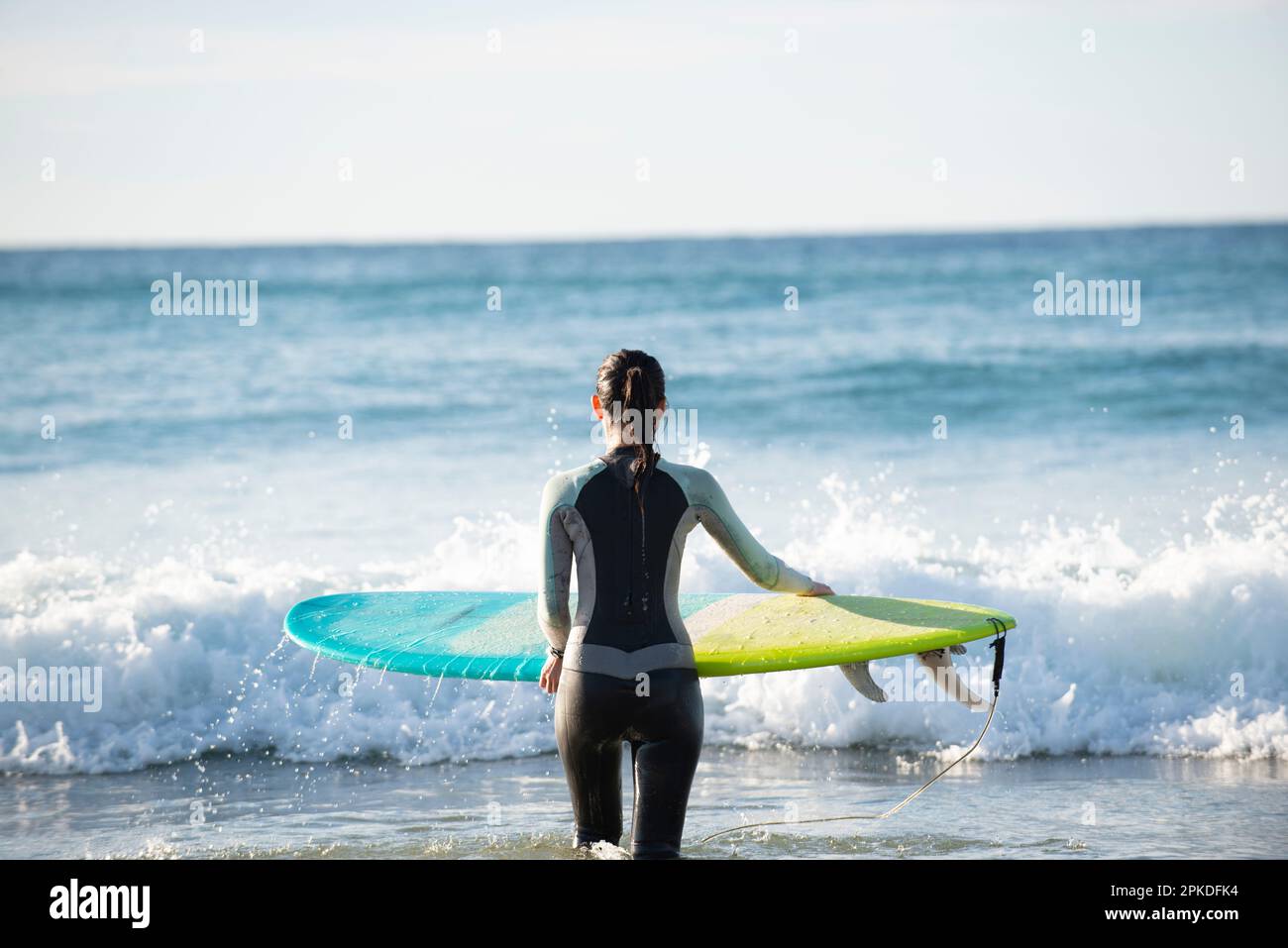 Woman in wetsuit carrying hi-res stock photography and images - Alamy