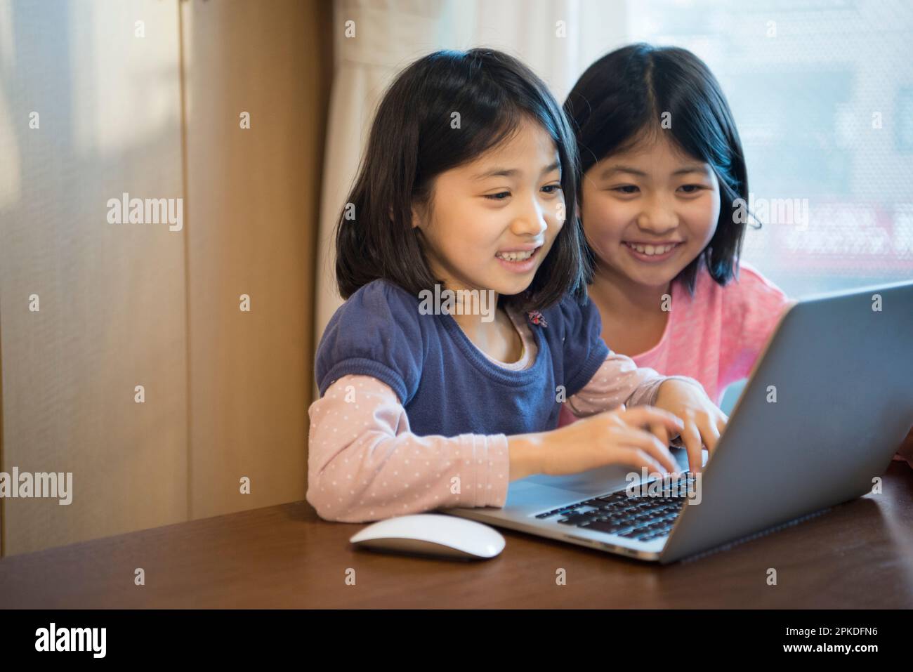 Children looking at a computer screen Stock Photo - Alamy