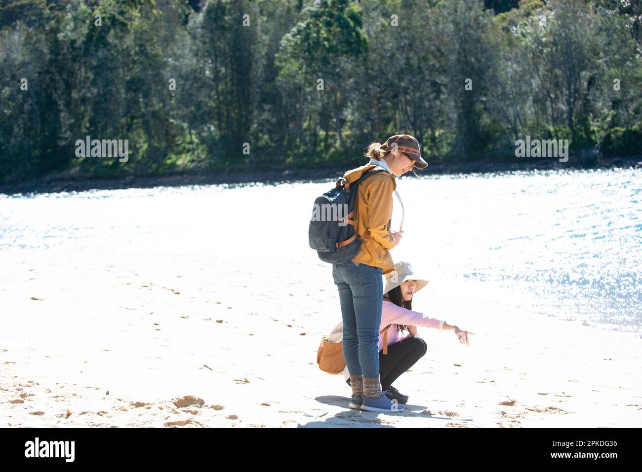2 women playing by the river Stock Photo - Alamy