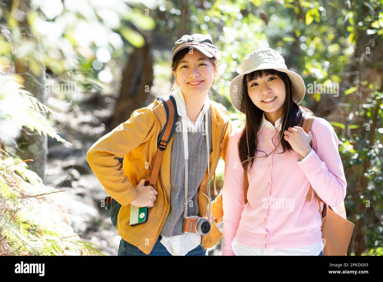 Two women hiking in the woods Stock Photo - Alamy