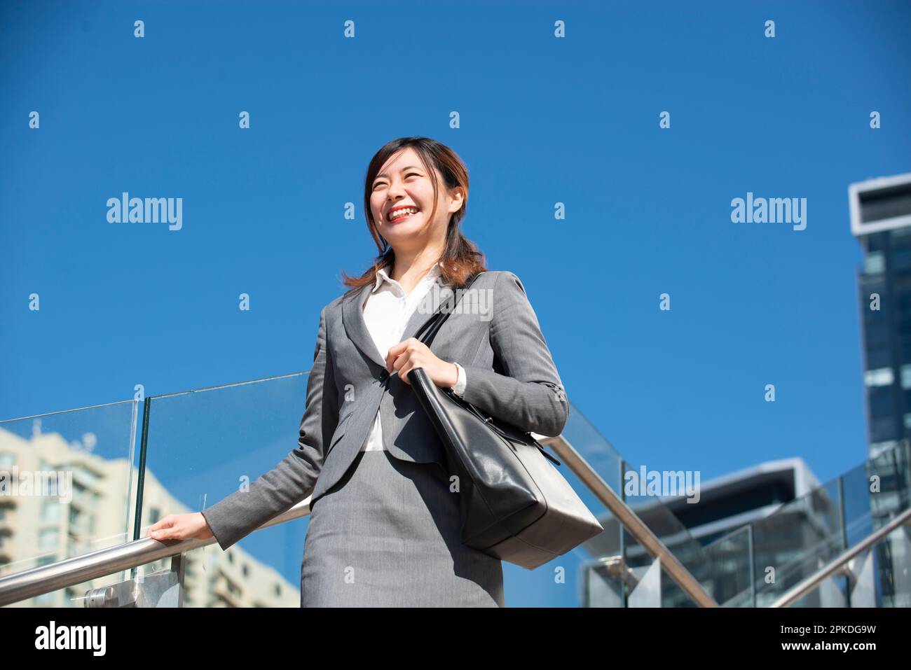 Woman going down stairs hi-res stock photography and images - Alamy