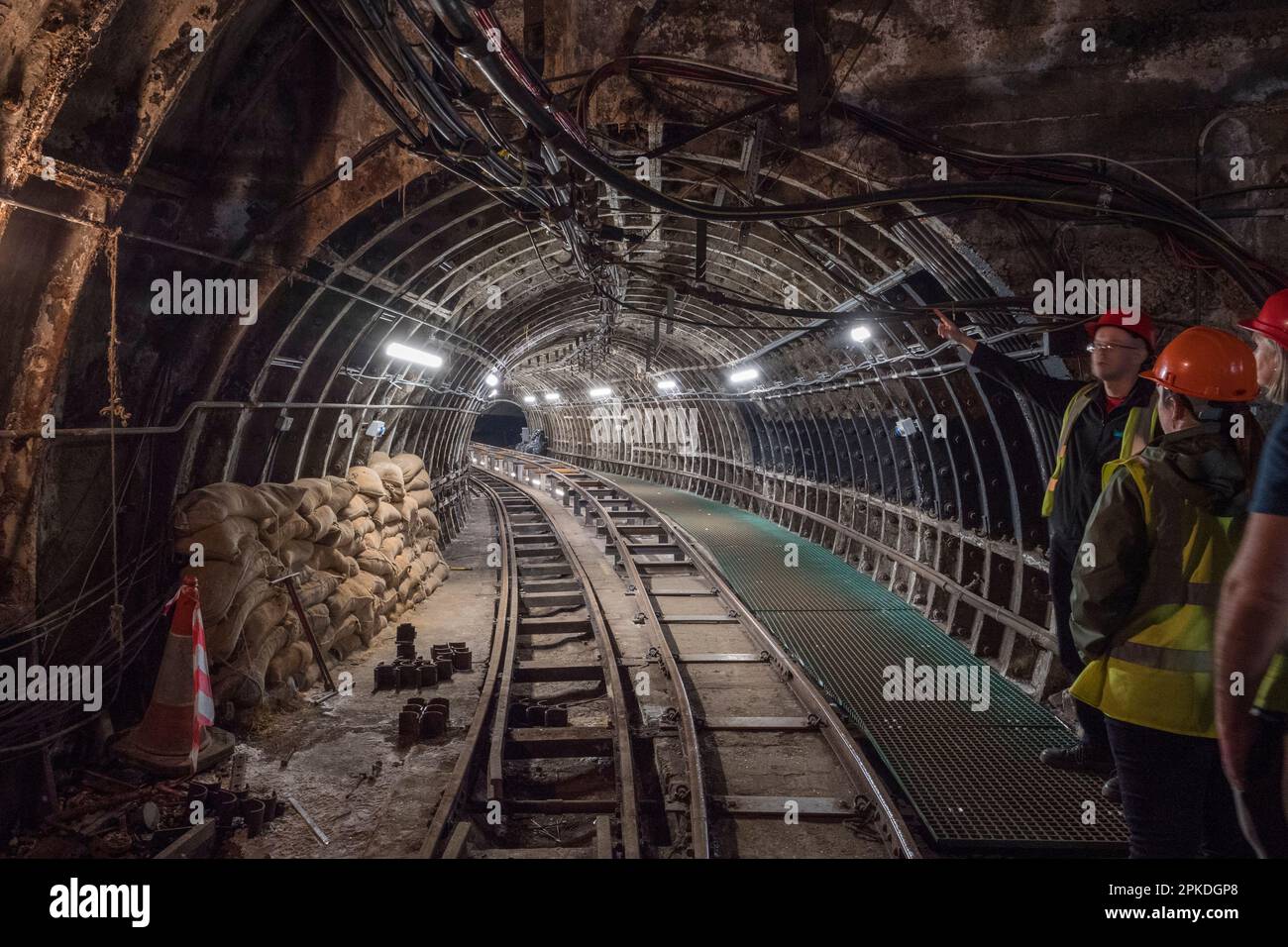 A tour group in the train maintenance area of Mail Rail, the former ...