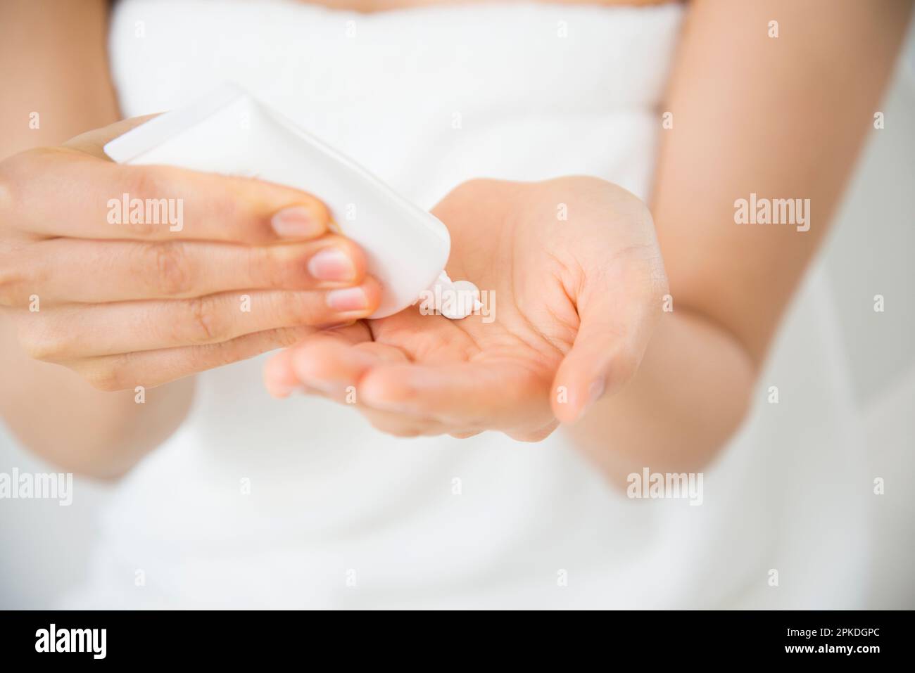 Woman tube cream into hand hi-res stock photography and images - Alamy