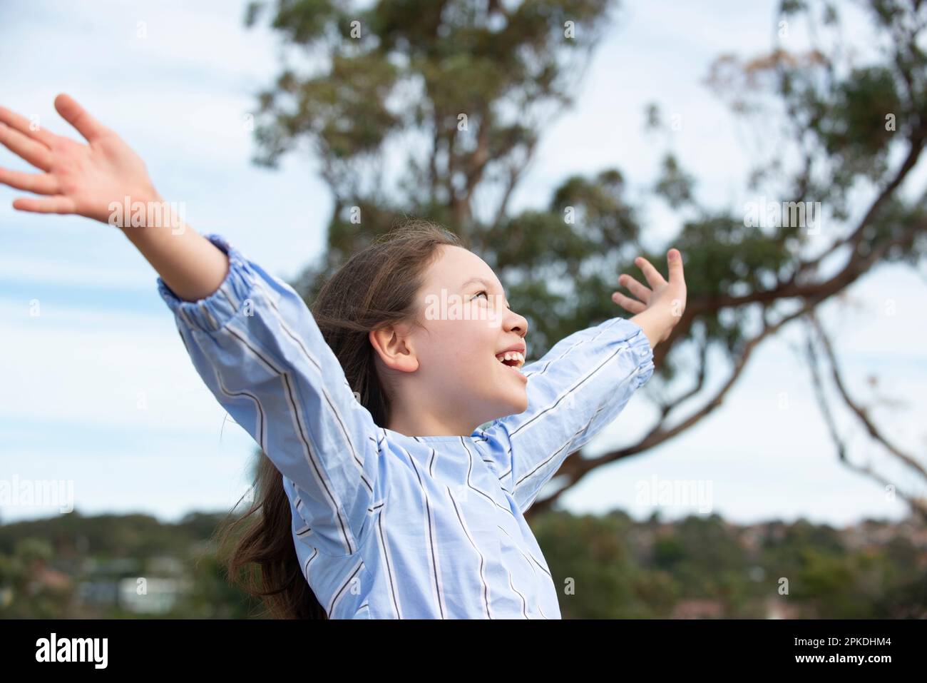 Half-girl posing in front of tree Stock Photo - Alamy