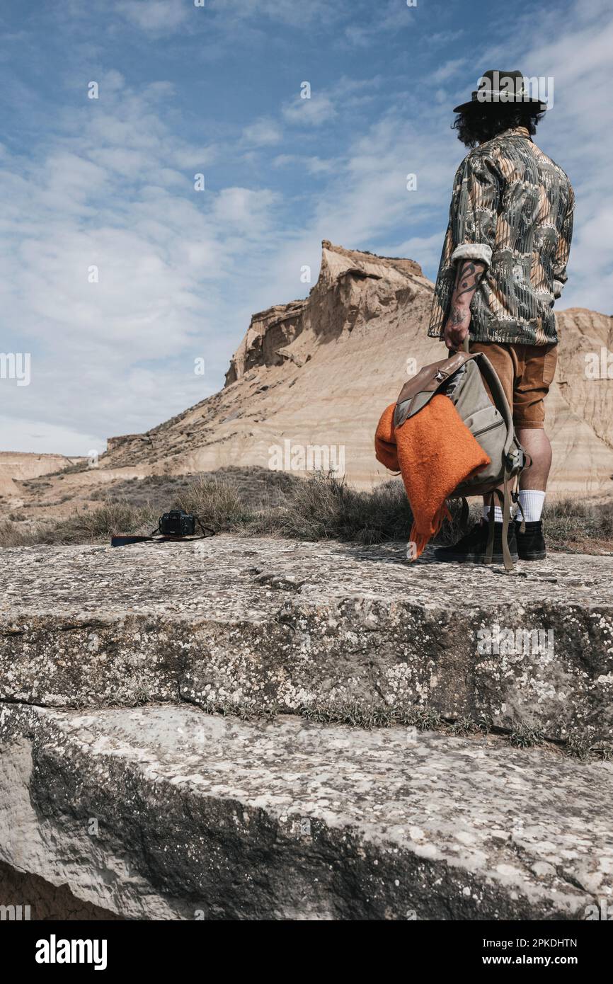 Back view of man on hiking tour to discover wild lands on vacation, man ...