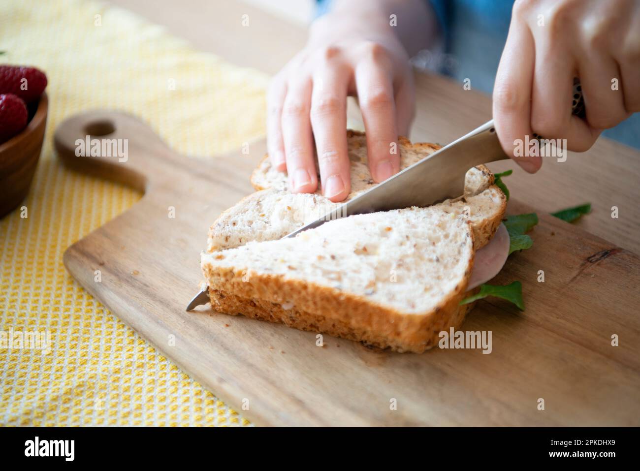 Hand eating sandwich hi-res stock photography and images - Alamy