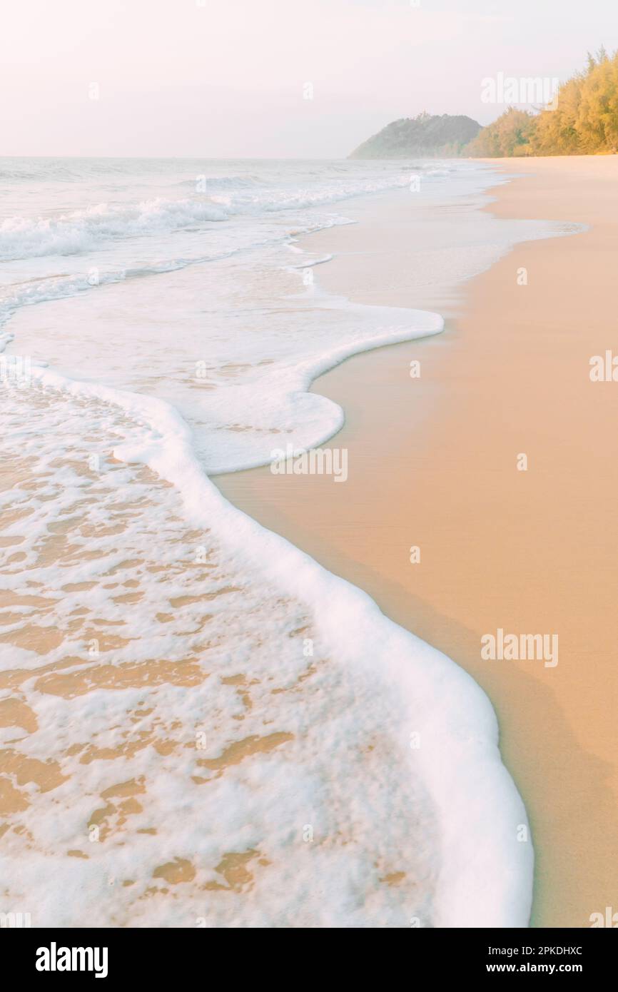 White ocean waves on the beach in a romantic morning Stock Photo - Alamy
