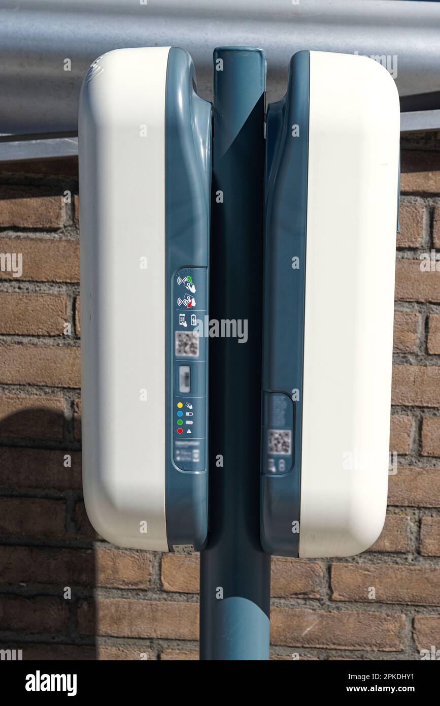 vertical front view of an electric car charging station placed just in ...