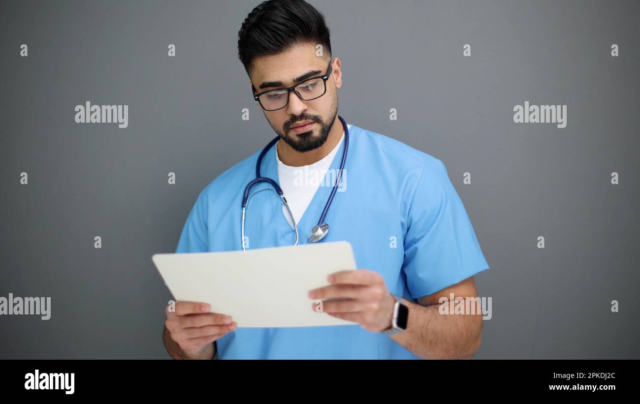 doctor doing paperwork checking medical documents at workplace Stock ...