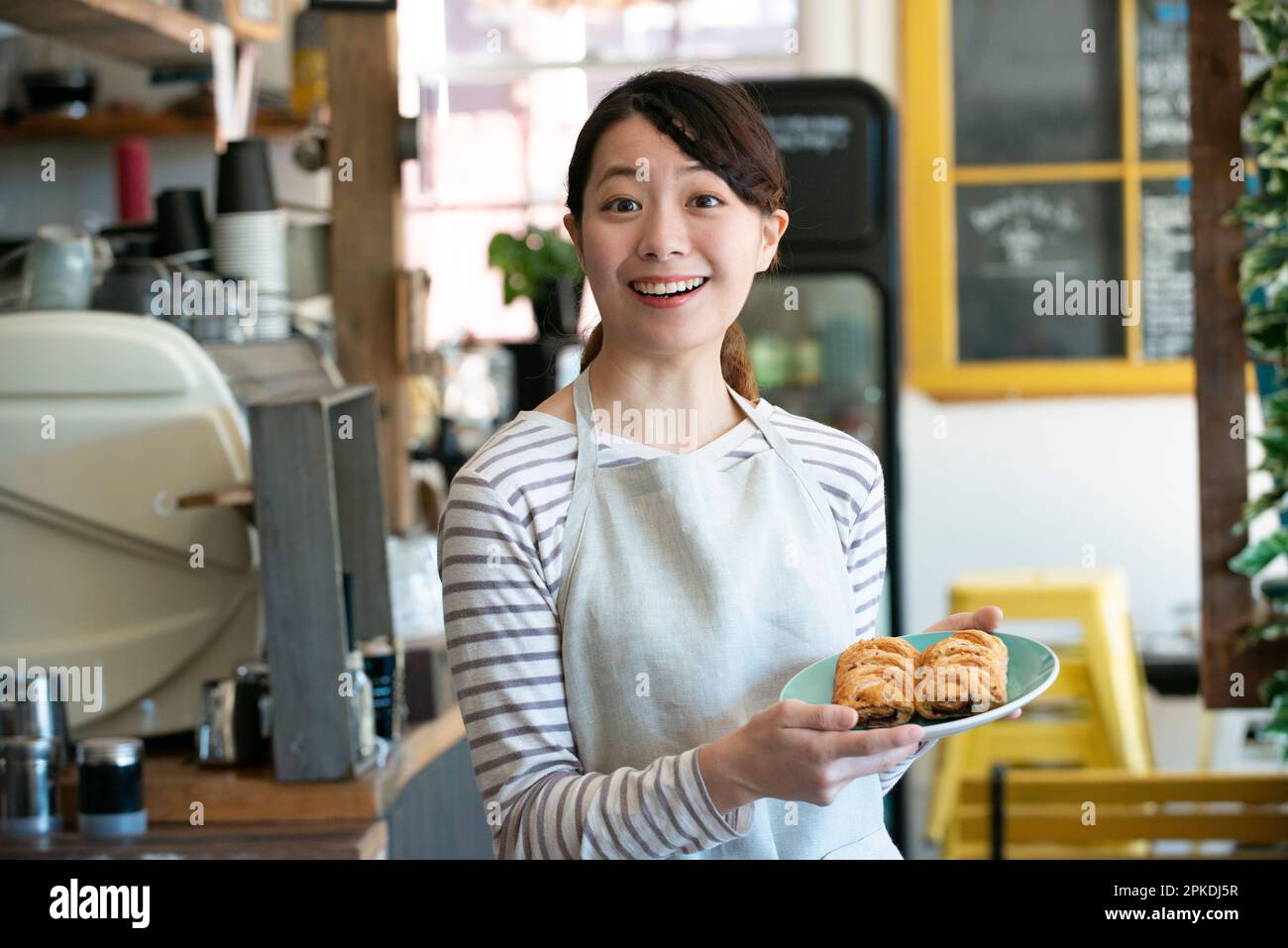 Asian woman eating bread hi-res stock photography and images - Alamy