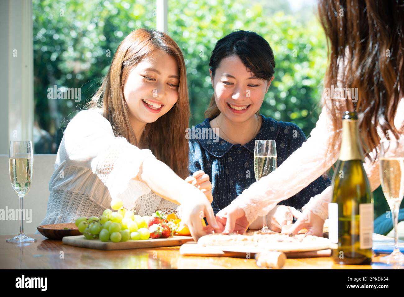 Three women smiles hi-res stock photography and images - Alamy