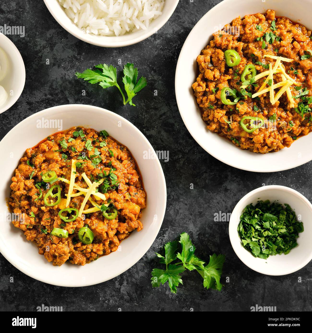 Keema curry in bowls over dark stone background. Indian and pakistani ...
