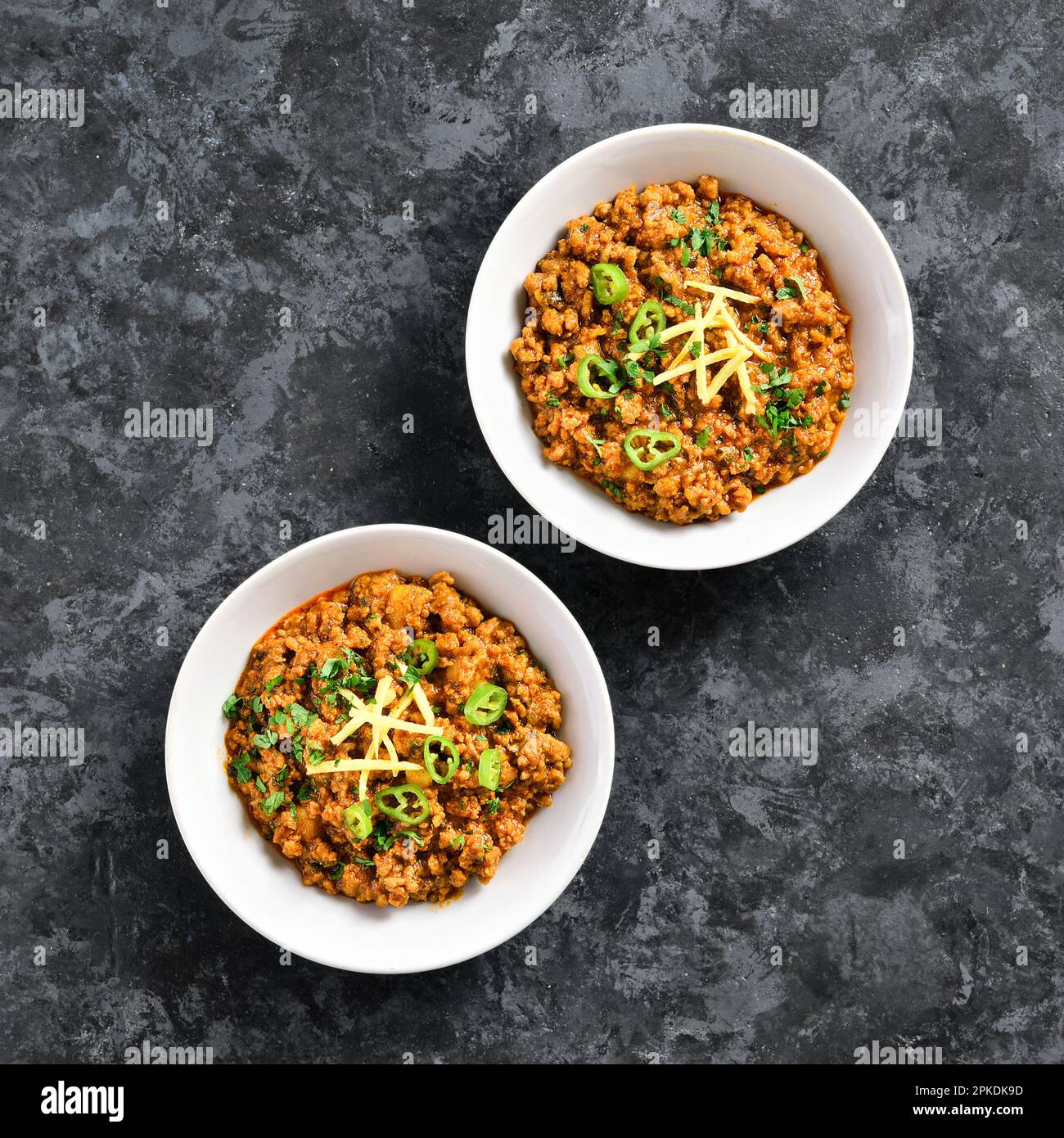 Keema curry in bowls over dark stone background. Indian and pakistani ...