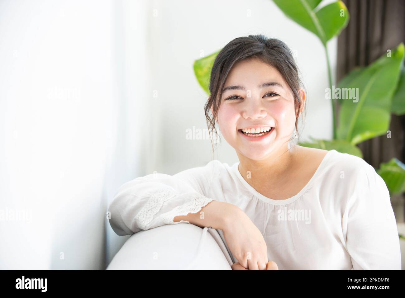 Japanese woman sitting on couch hi-res stock photography and images - Alamy