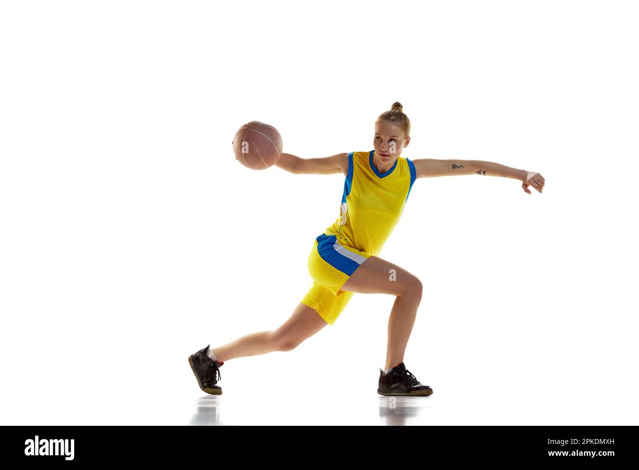 Concentration and motivation to win. Young girl, basketball player in ...