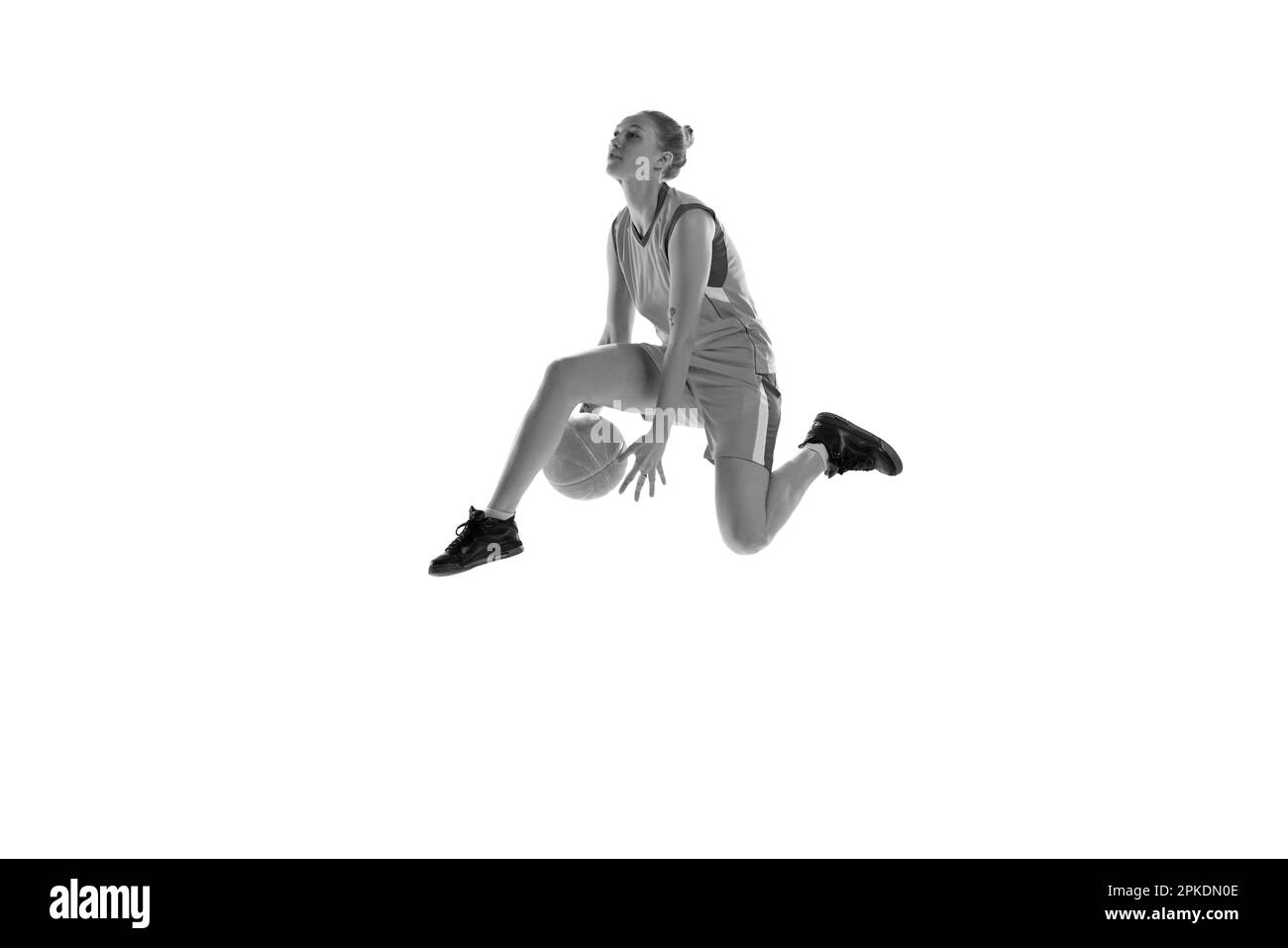 Black and white image of young athletic girl playing, training ...