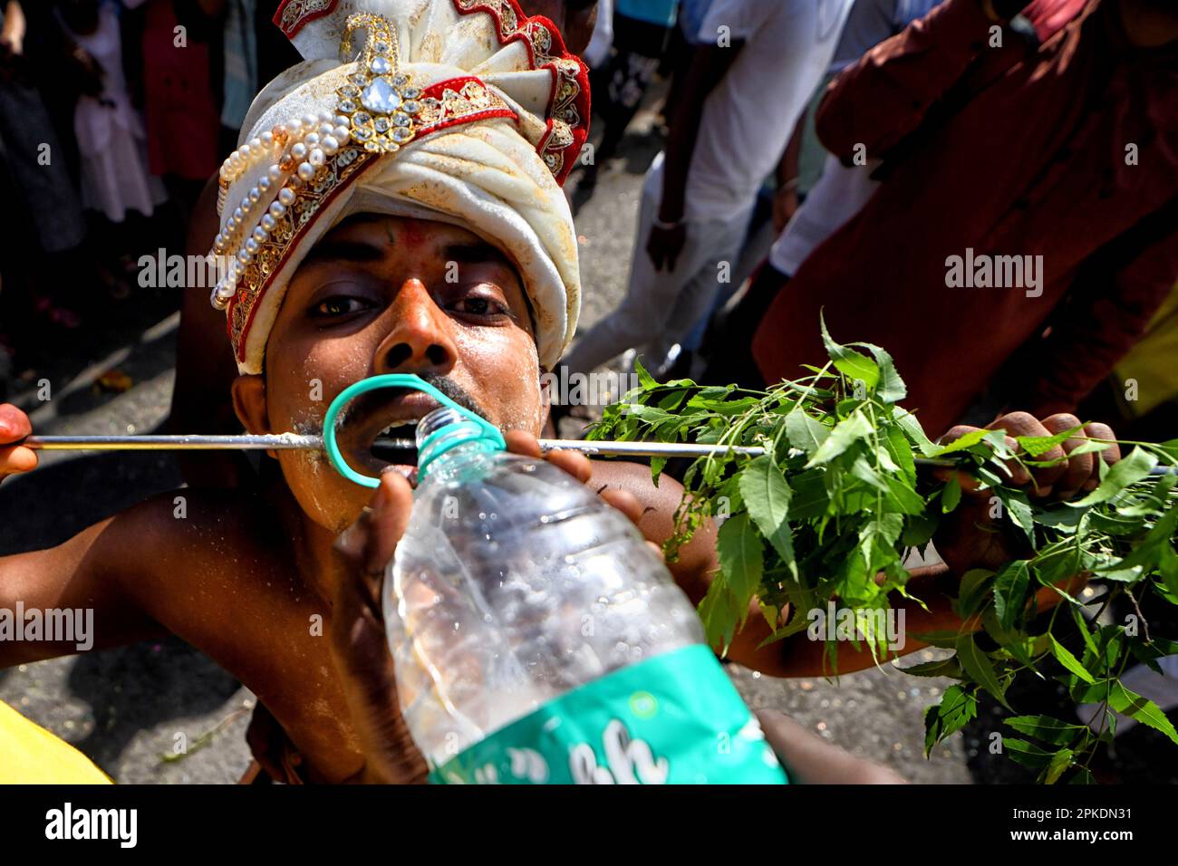 Bandel, India. 06th Apr, 2023. A pierced Hindu devotee seen drinking ...