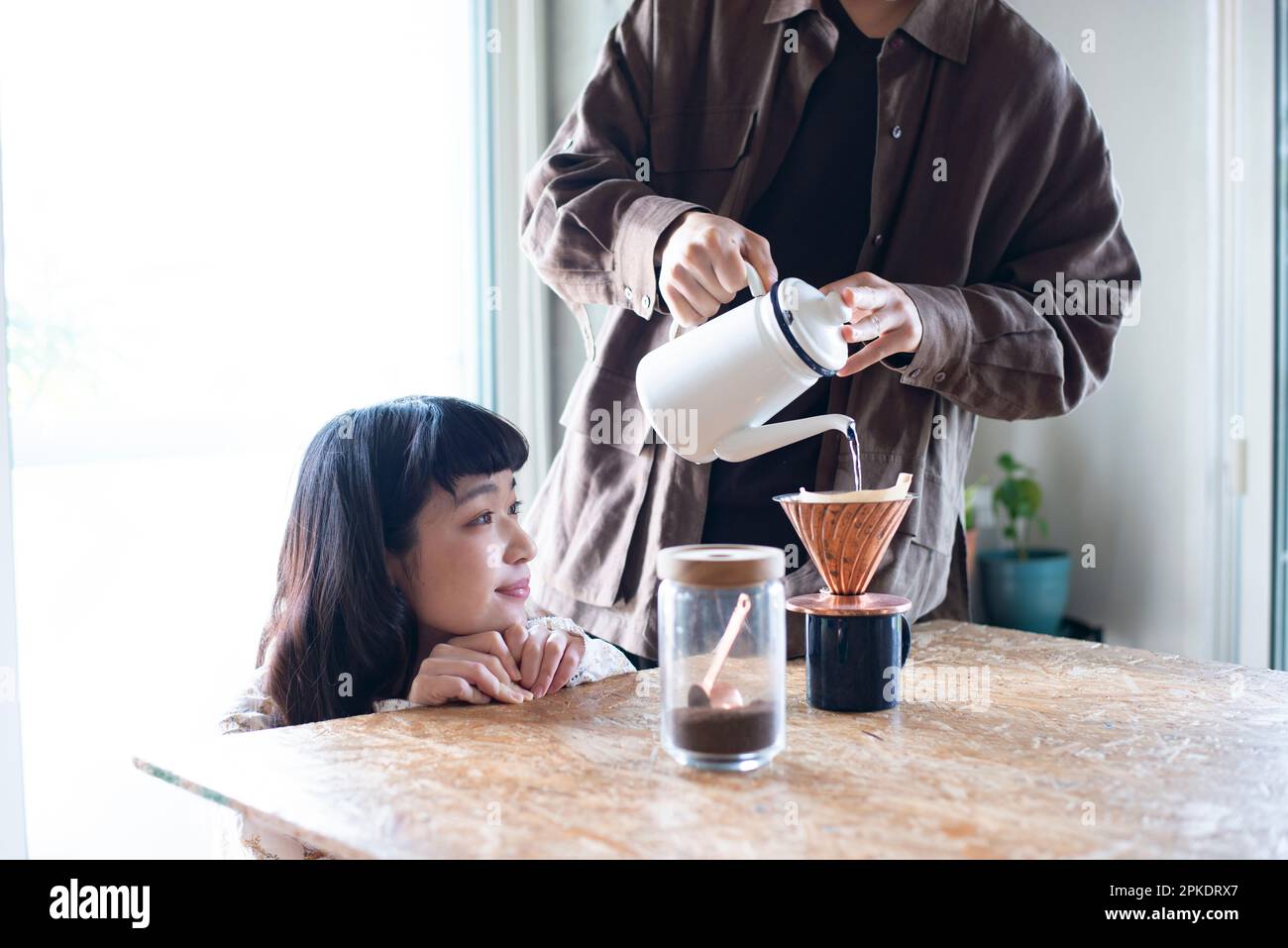 Woman making coffee home hi-res stock photography and images - Alamy