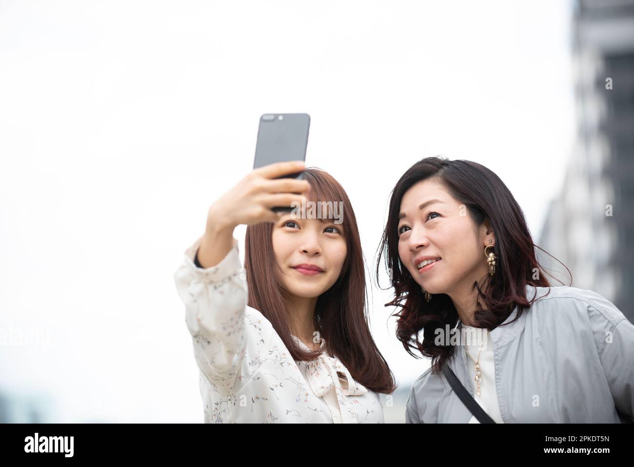 Parent and child taking a selfie Stock Photo - Alamy