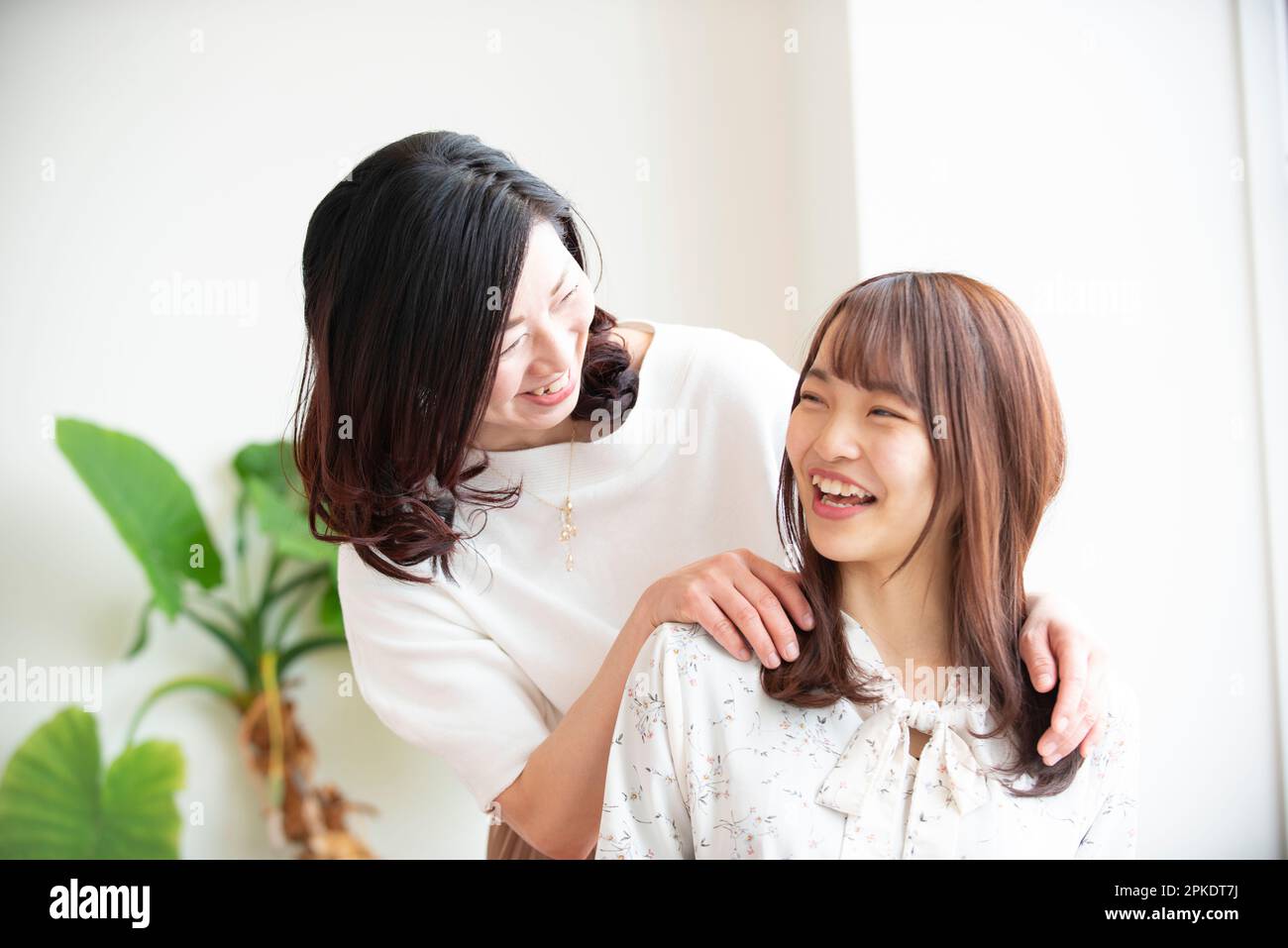 Parent and child looking at each other and laughing Stock Photo - Alamy