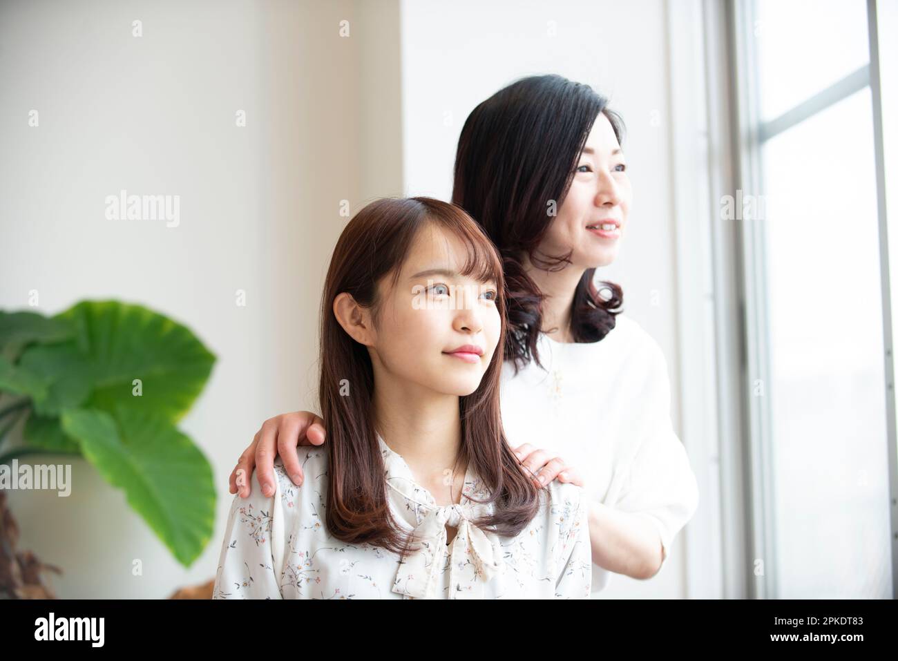 Parent and child looking out the window Stock Photo - Alamy Parent and child looking out the window Stock Photo - Alamy