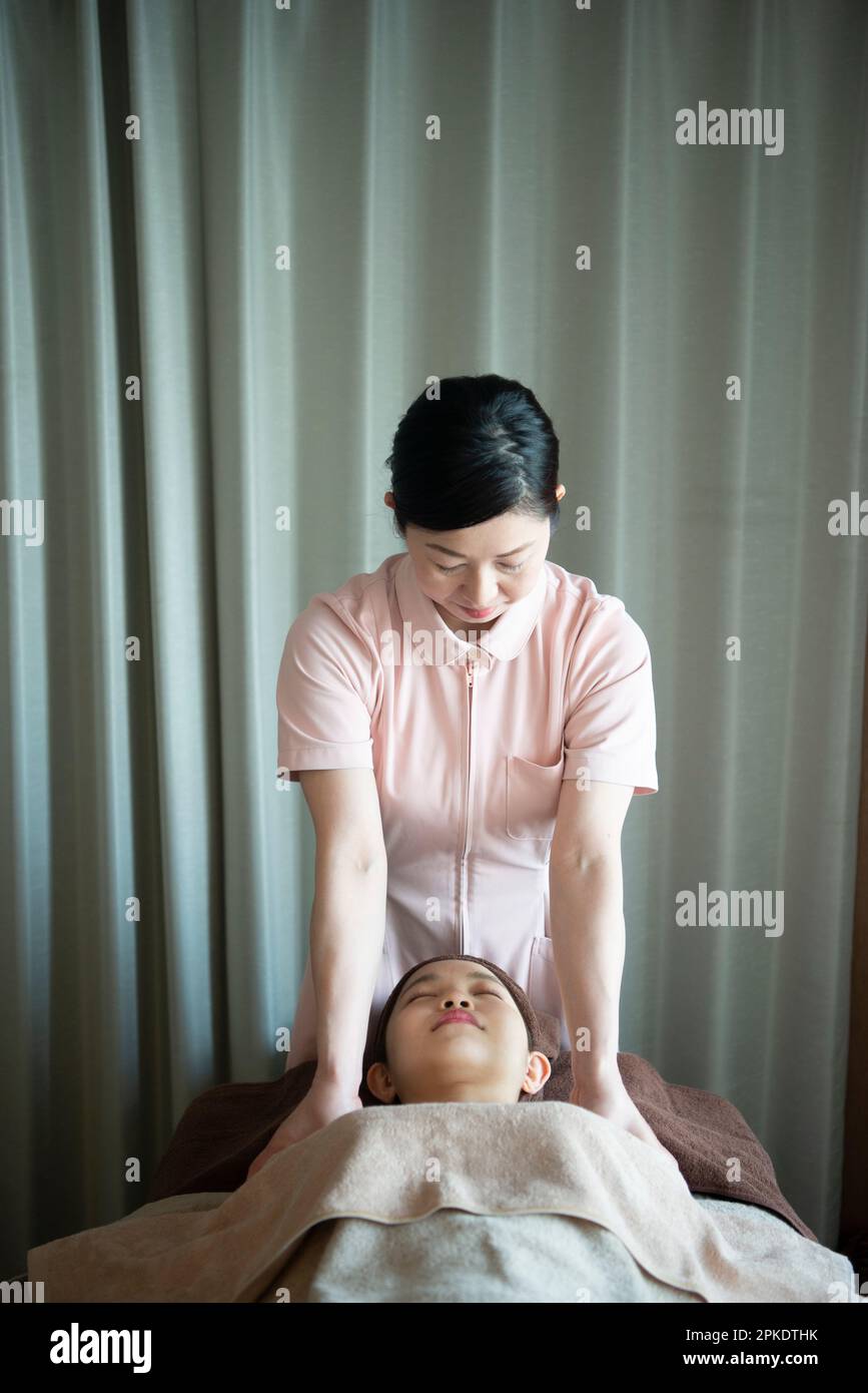 Woman receiving massage treatment hi-res stock photography and images ...