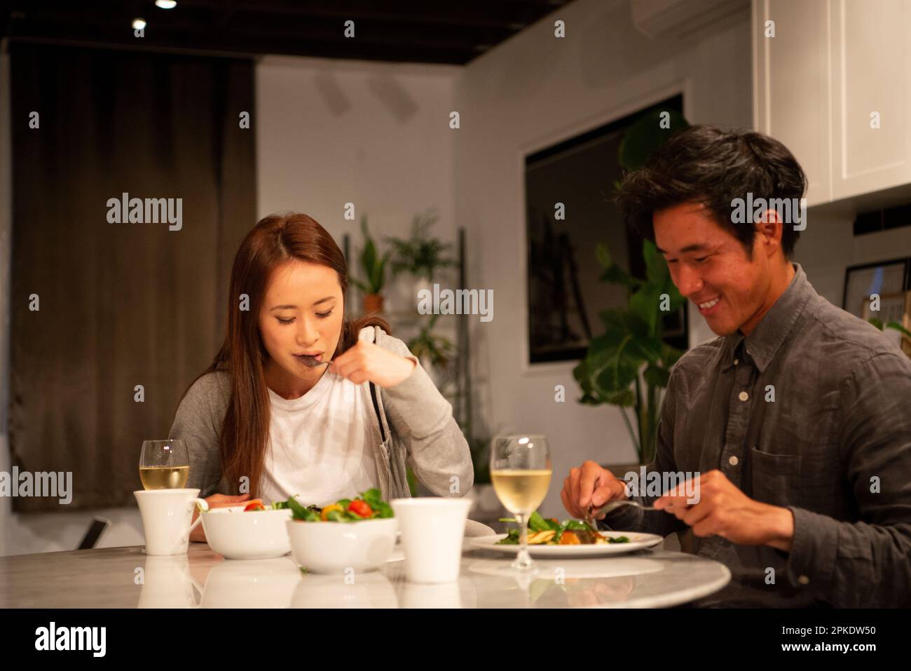 Couple having dinner at home Stock Photo - Alamy