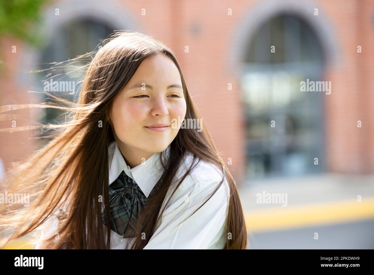 Female student in school uniform smiling Stock Photo - Alamy