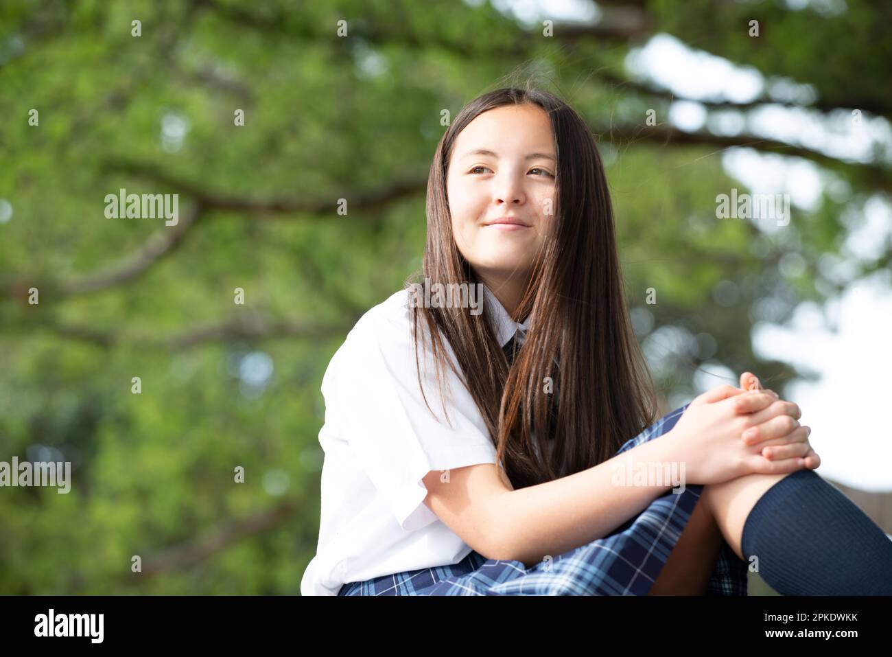 Female student in school uniform smiling Stock Photo - Alamy