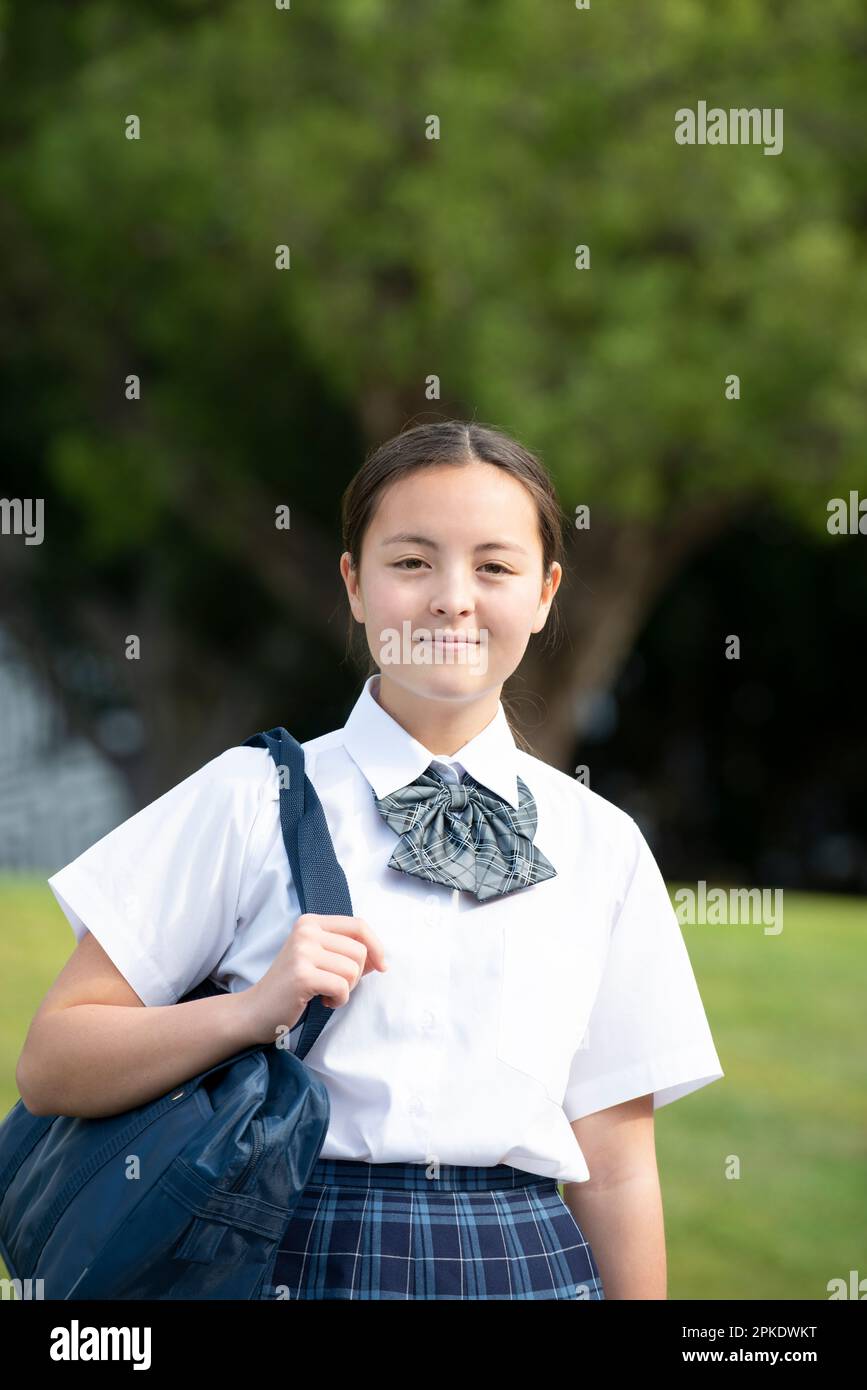 Female student in school uniform looking at us Stock Photo - Alamy