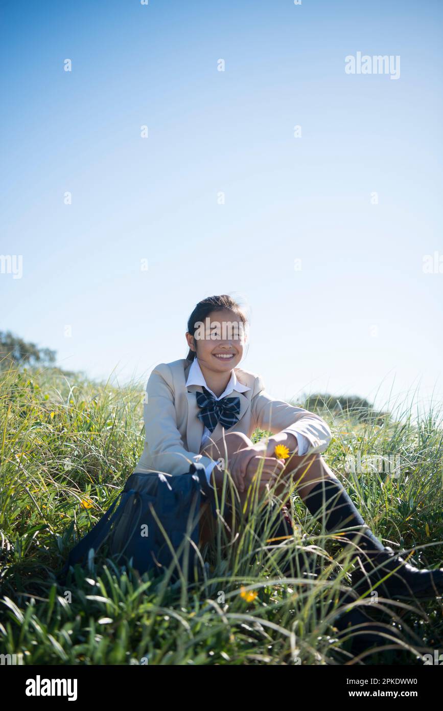 School uniform sitting hi-res stock photography and images - Alamy
