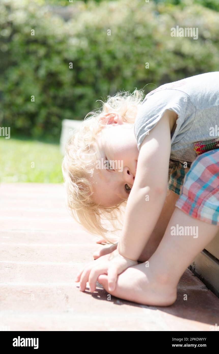 Boy looking down Stock Photo - Alamy