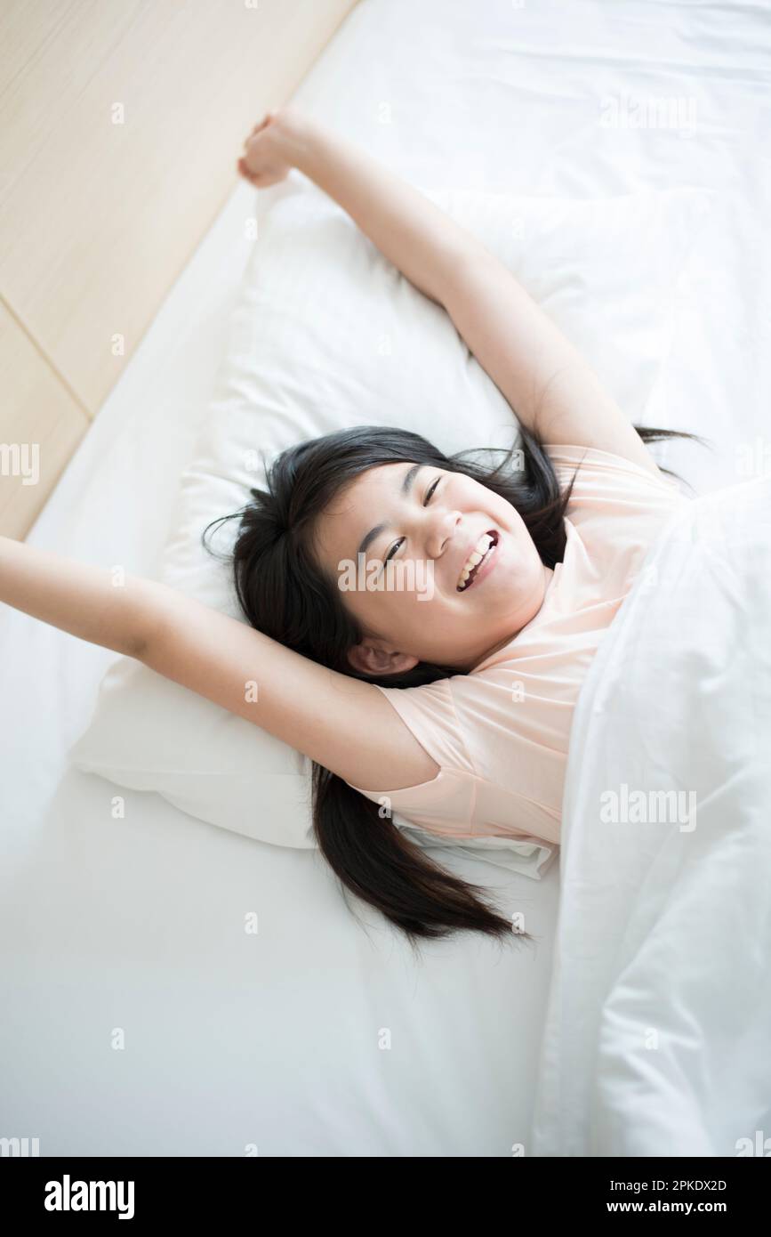 Stretch girl bed hi-res stock photography and images - Alamy