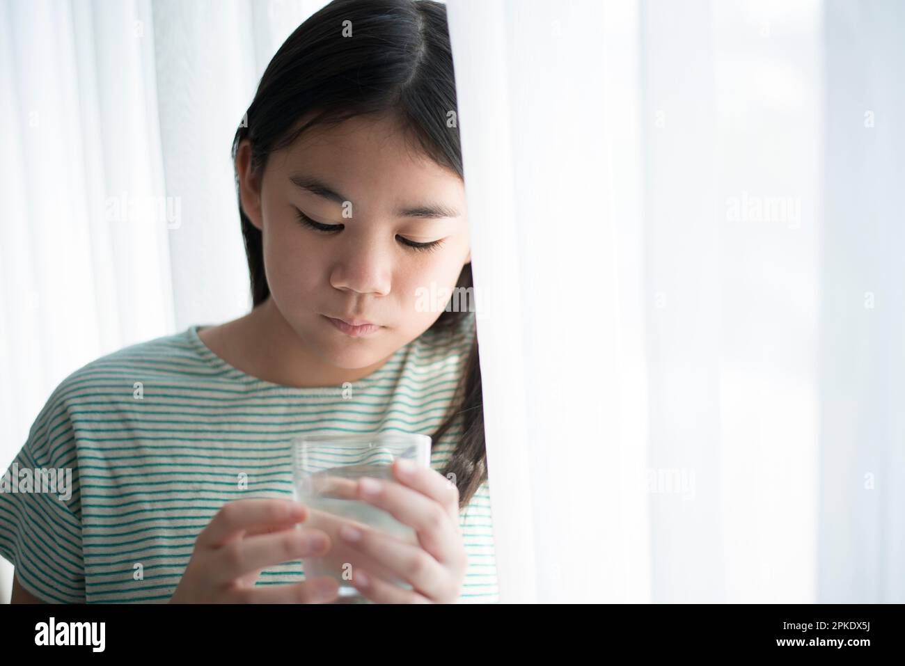 Girl entering the water hi-res stock photography and images - Alamy