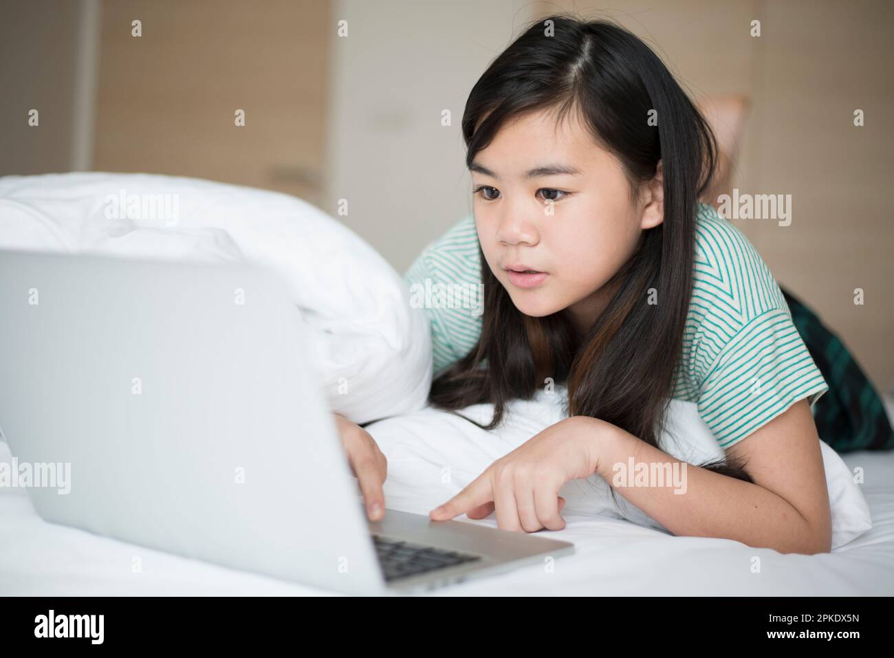 Girl looking at computer Stock Photo - Alamy