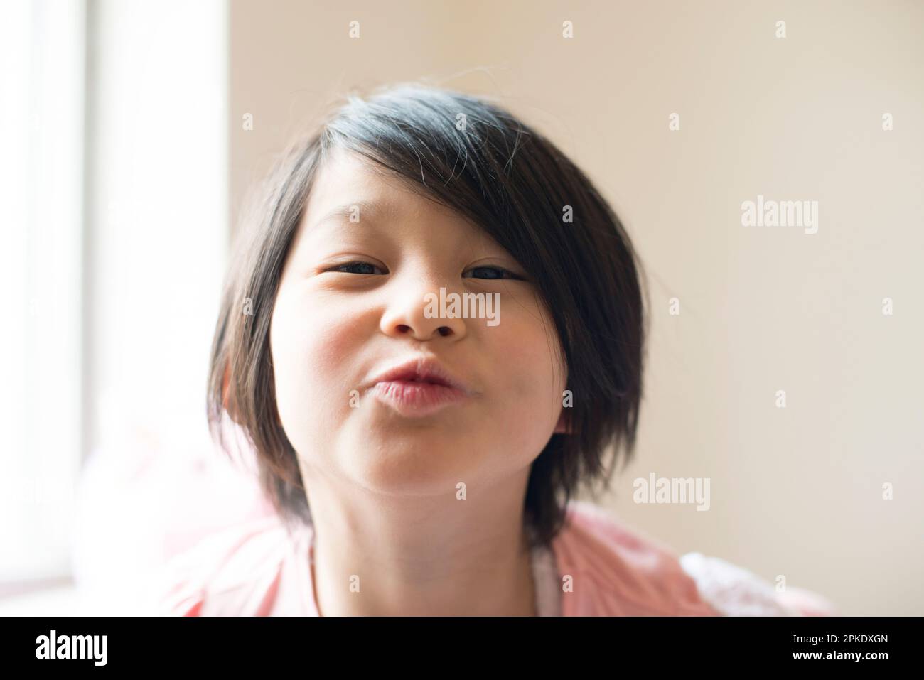 Girl making funny face Stock Photo - Alamy