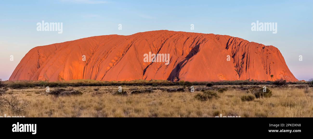 Banner format view of the famous large sandstone formation of Uluru ...