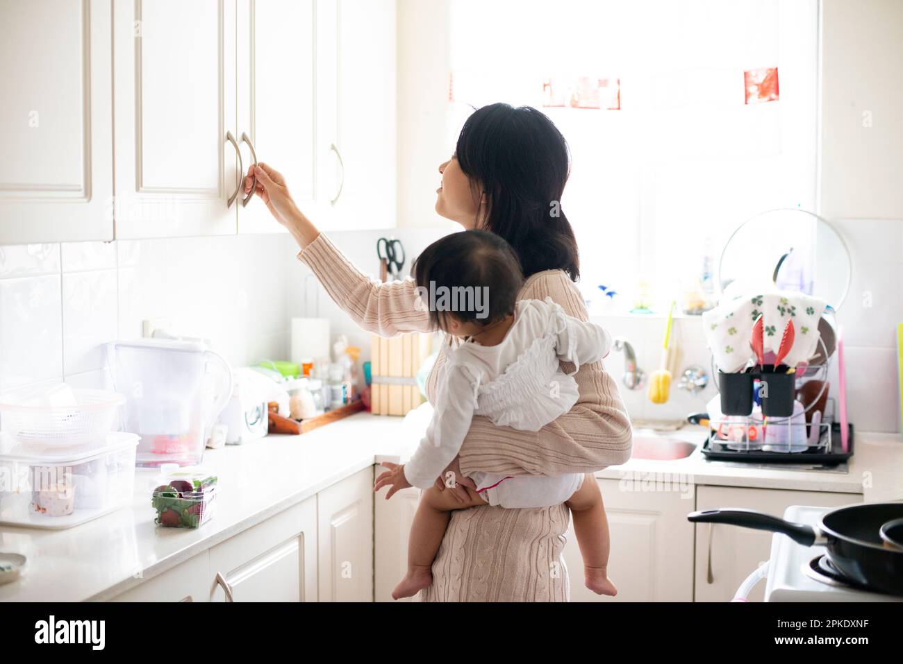 Child and mother doing housework hi-res stock photography and images ...