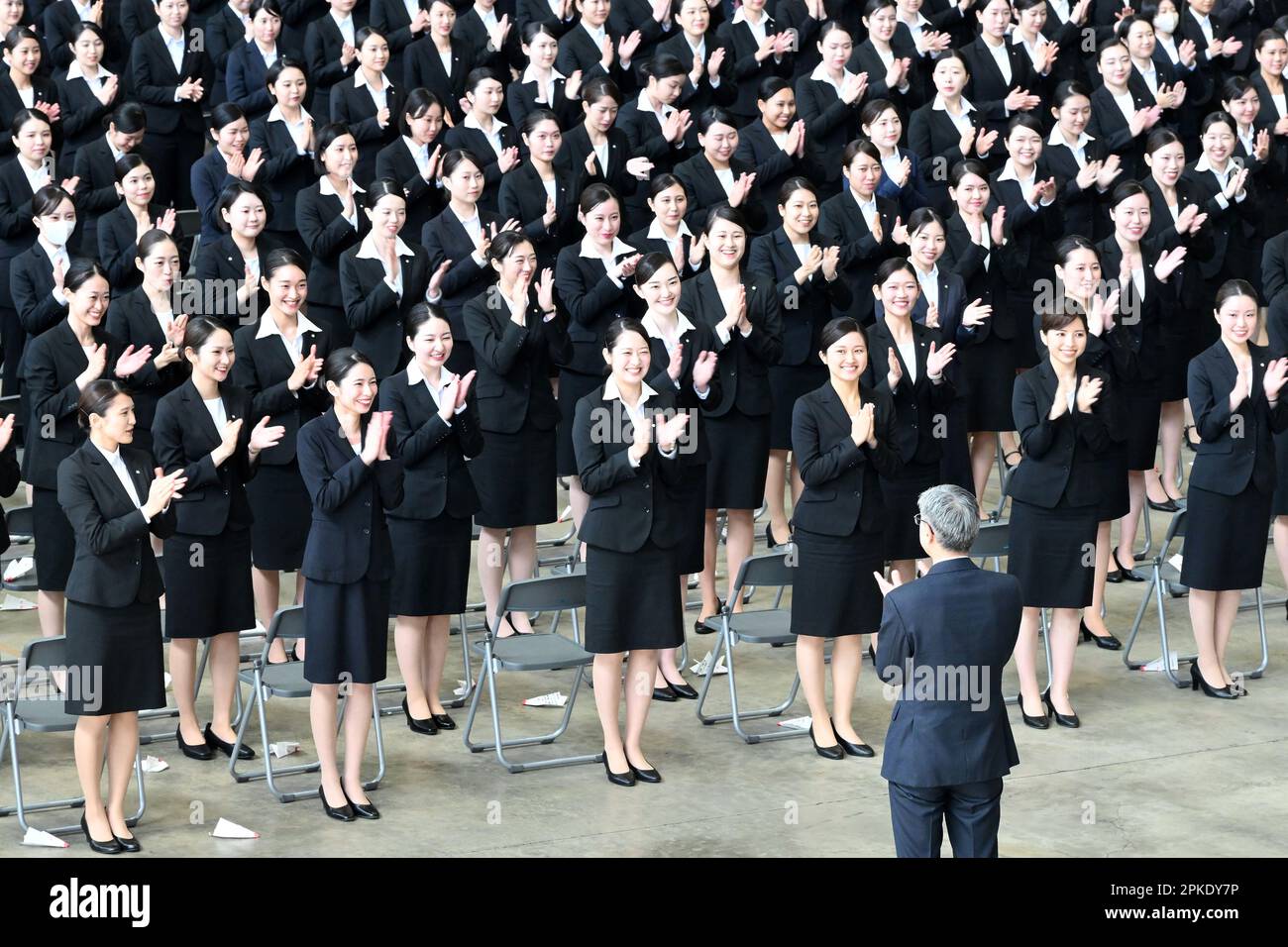 JAL President Yuji AKASAKA with new employees after flying paper ...