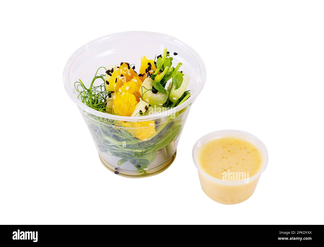 Salad with microgreens peas, spinach, celery, orange, sesame seeds and ...