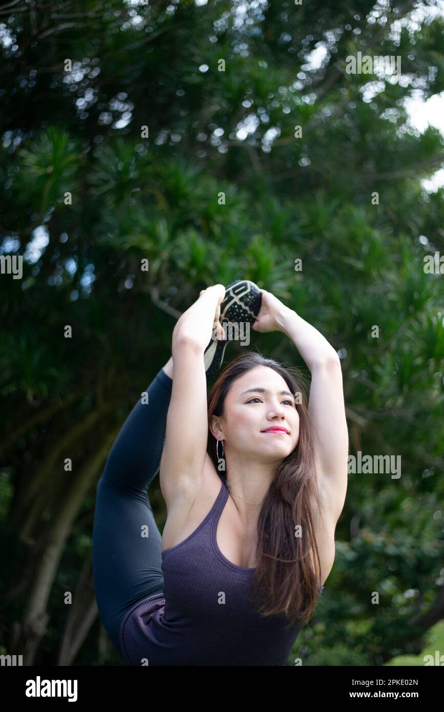 Asian woman doing yoga poses hi-res stock photography and images - Alamy